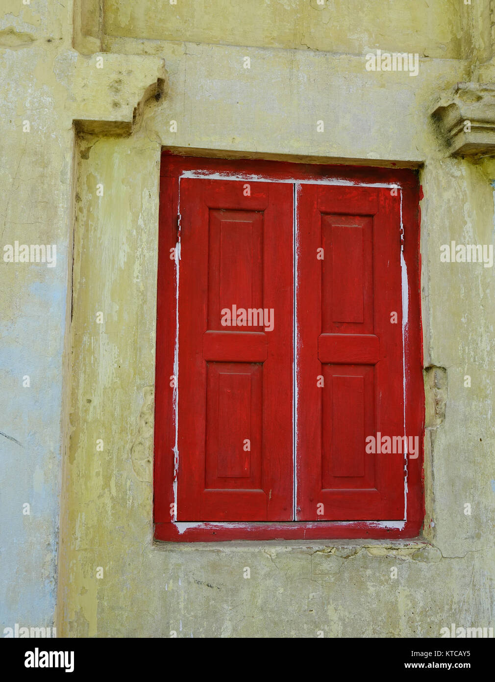 Red wooden window at old house in Pyin Oo Lwin, Myanmar. The small town ...