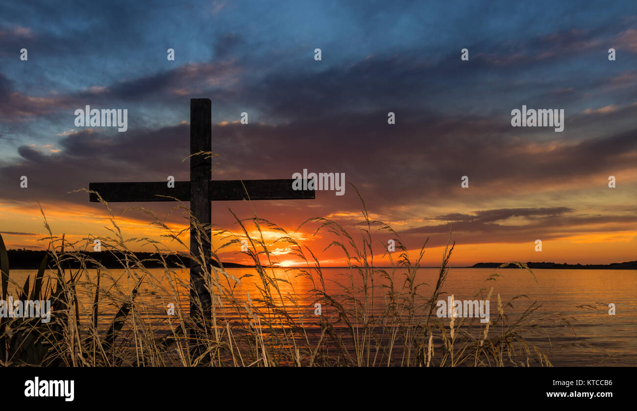 Sunset clouds behind cross hi-res stock photography and images - Alamy