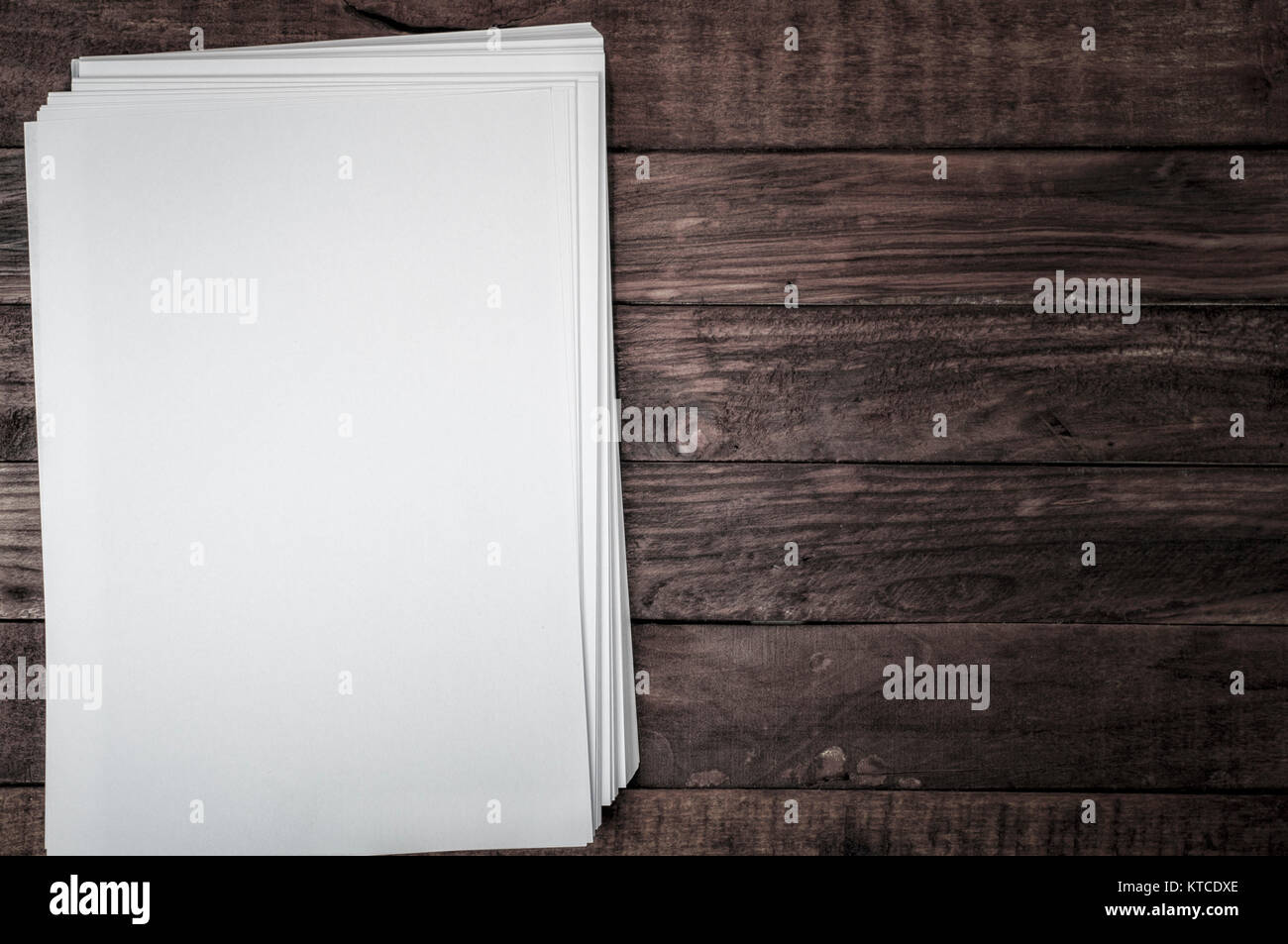 stack of sheets on white brown wooden surface Stock Photo - Alamy