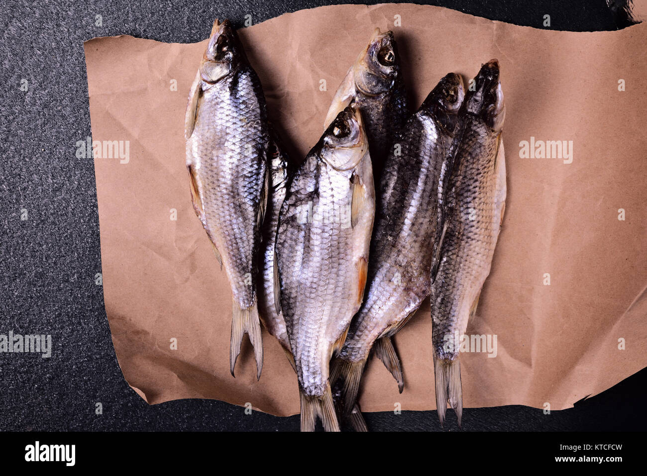 Fish ram is dried and lies on brown kraft paper Stock Photo - Alamy