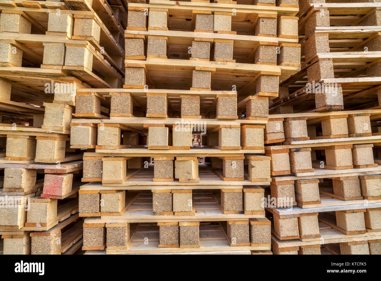 Close up of Piles of different types of pallet at a recycling business ...