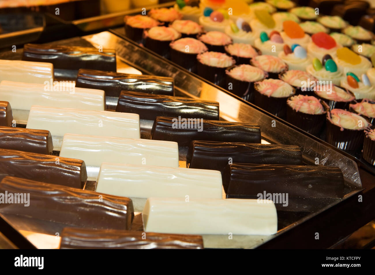 Chocolates in display window Stock Photo - Alamy