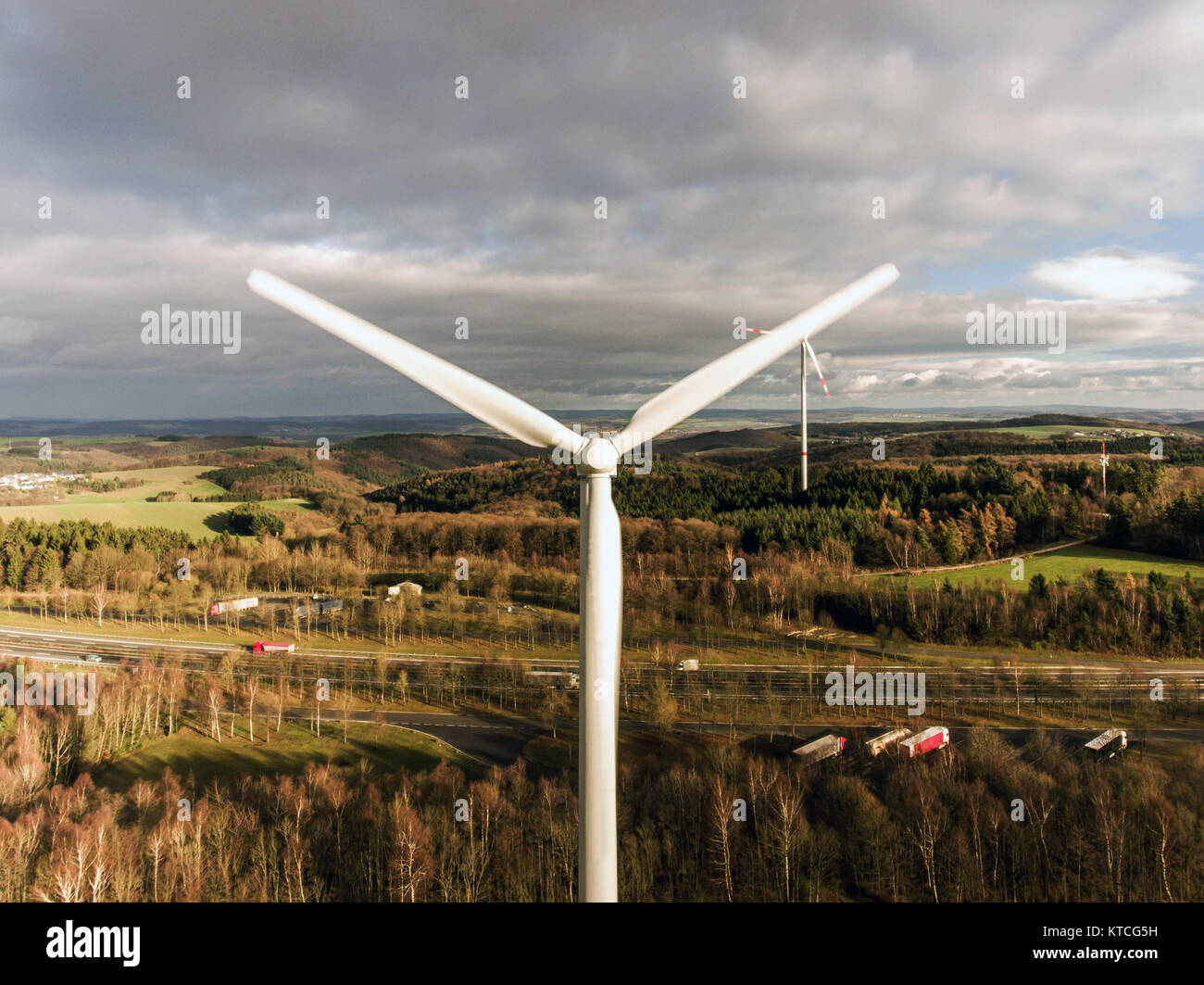 A panorama aerial helicopter view over wind farm landscape in Germany ...