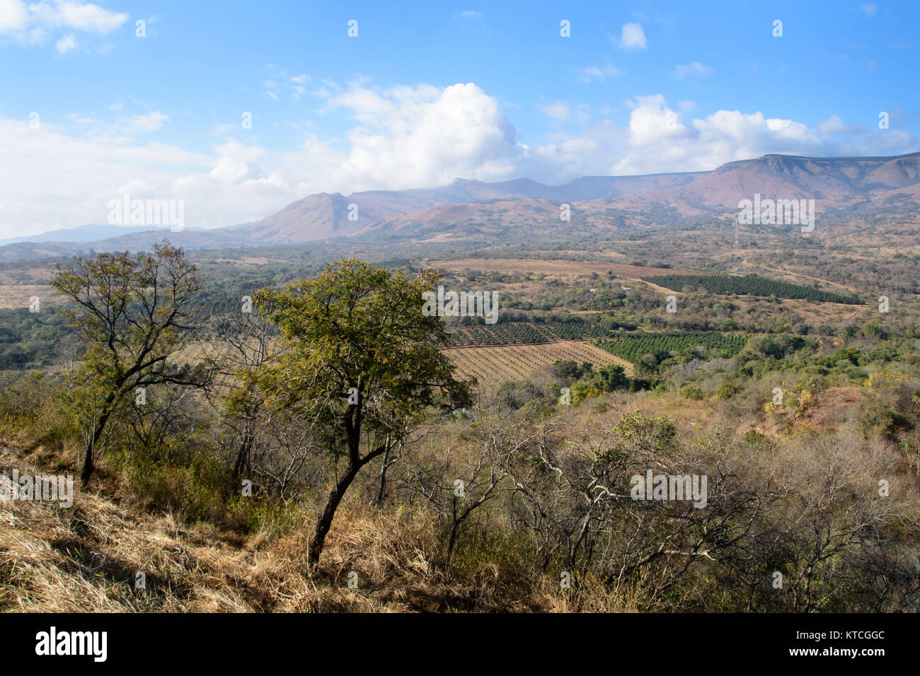 Elevated view over valley with farmland in the valley surrounded by ...