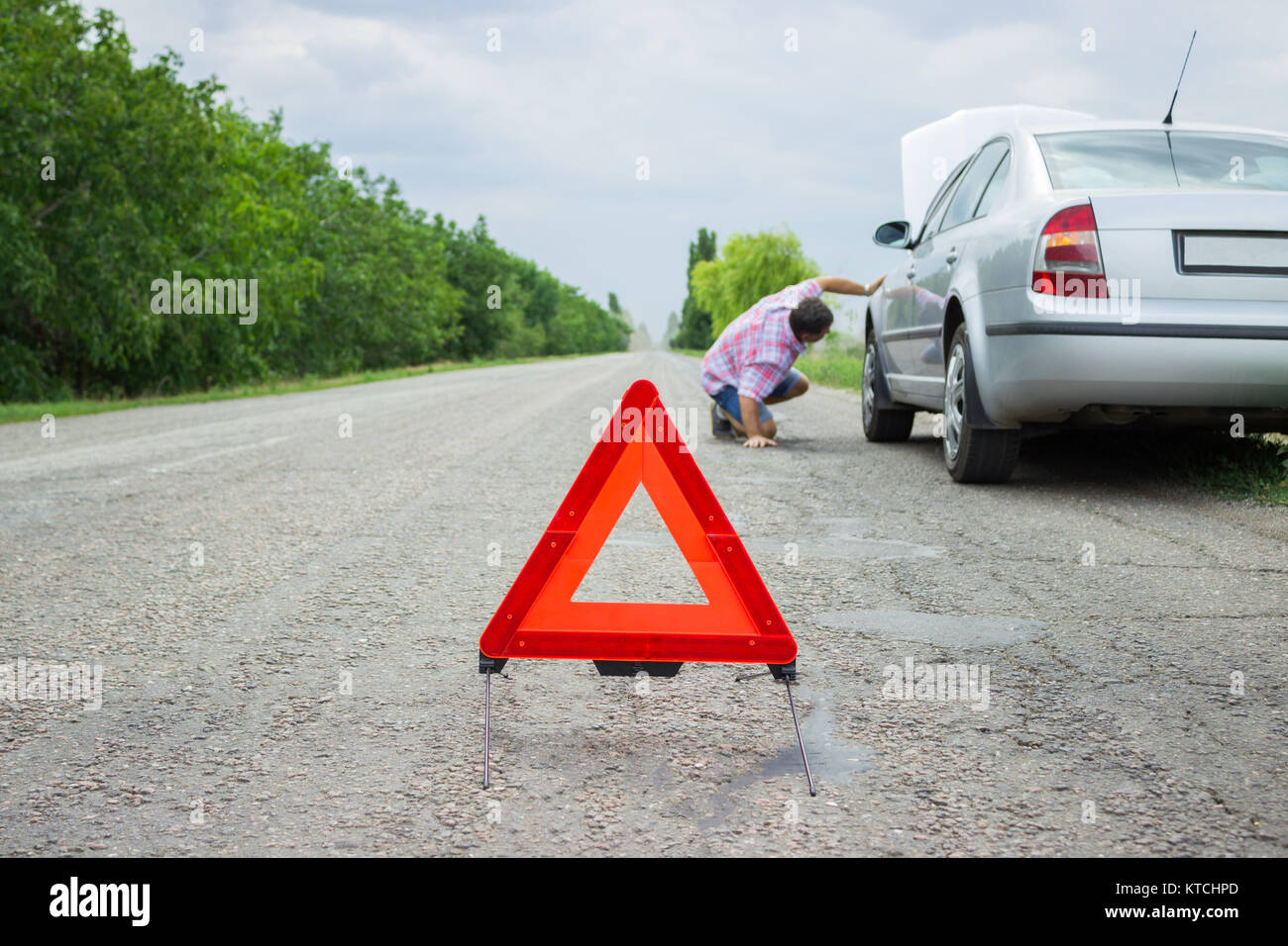 road sign, emergency and traffic concept - warning triangle over broken ...