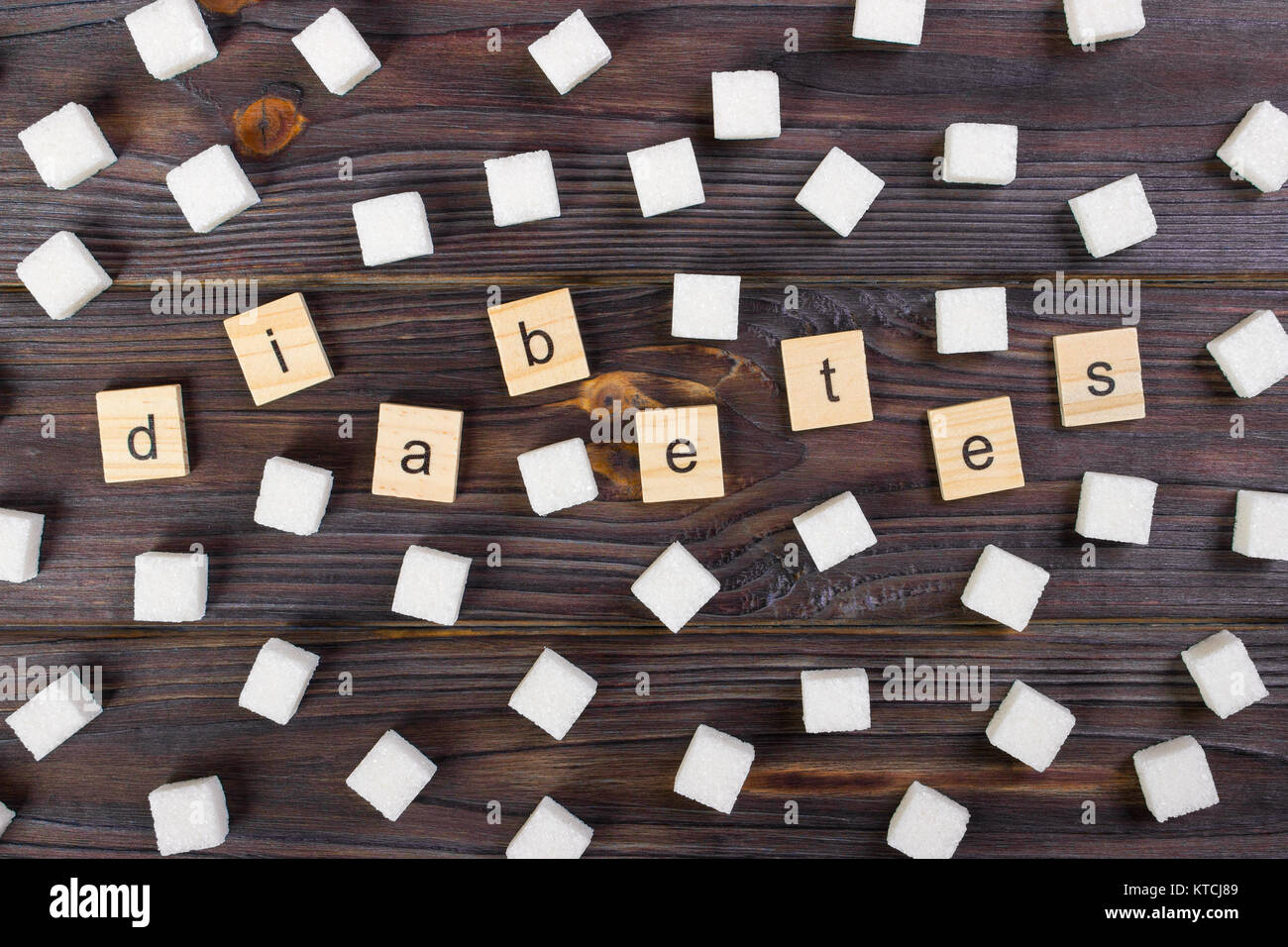 Diabetes Text On Sugar Cubes background On Wooden Desk Stock Photo - Alamy