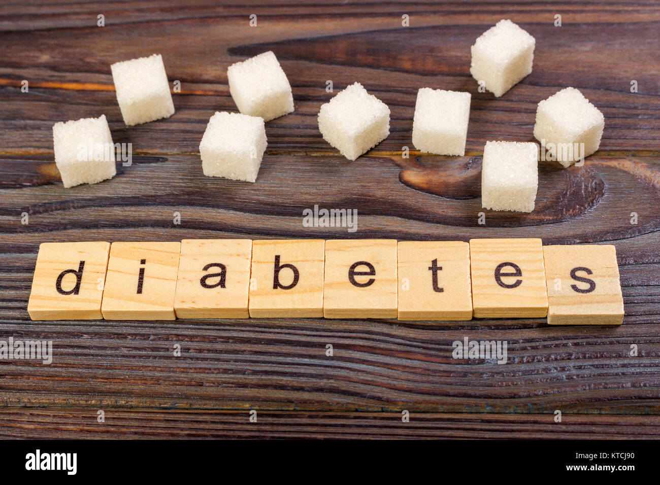 Diabetes block wooden letters with Refined sugar Stock Photo - Alamy