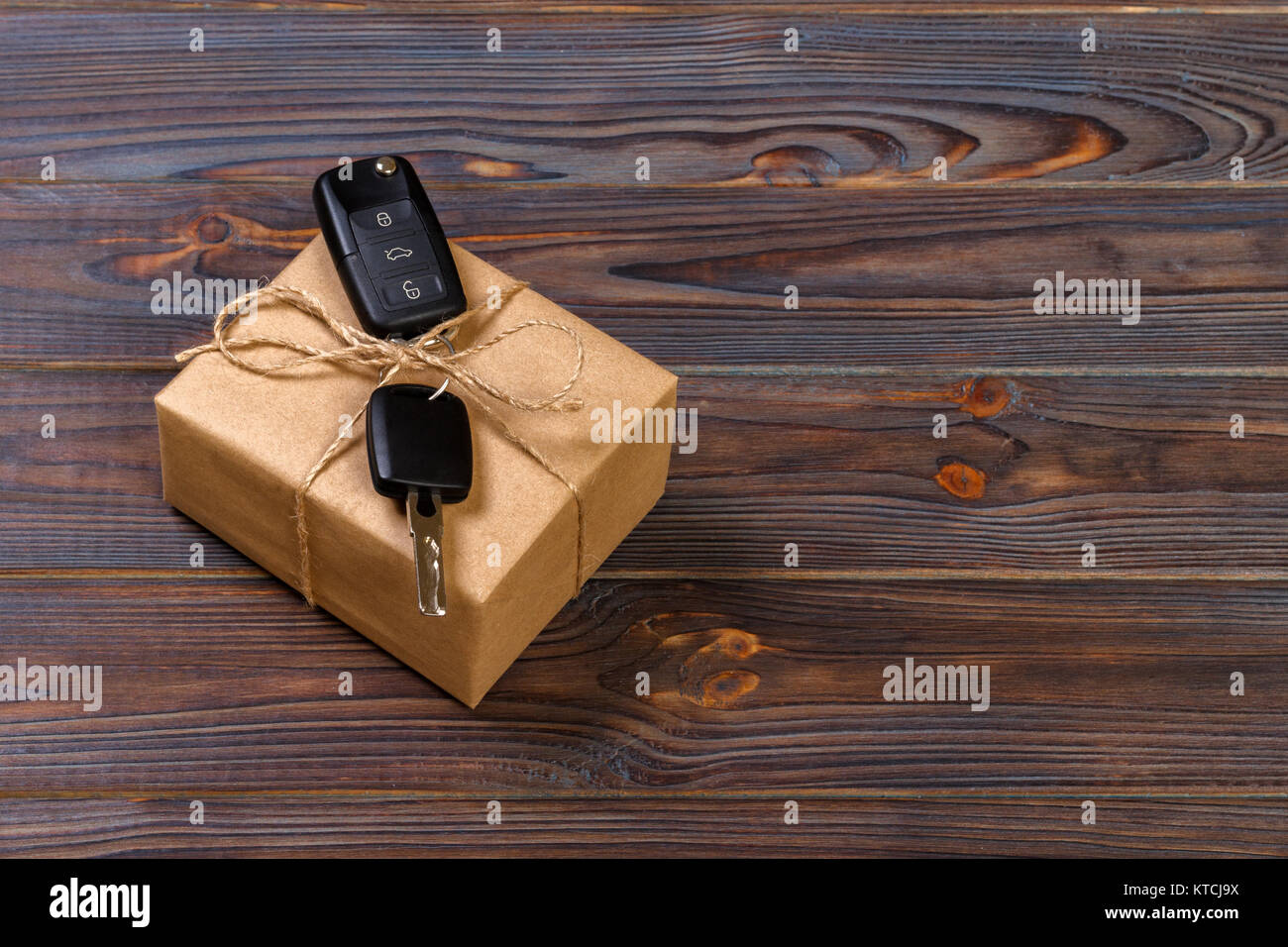 car key and gift box on dark background Stock Photo - Alamy