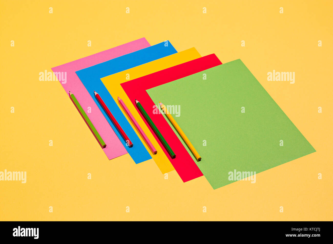 colored pencils and colour paper Stock Photo - Alamy