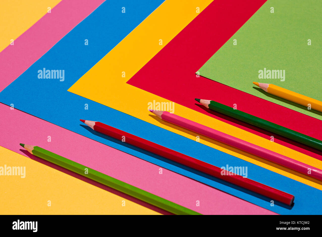 colored pencils and colour paper Stock Photo - Alamy