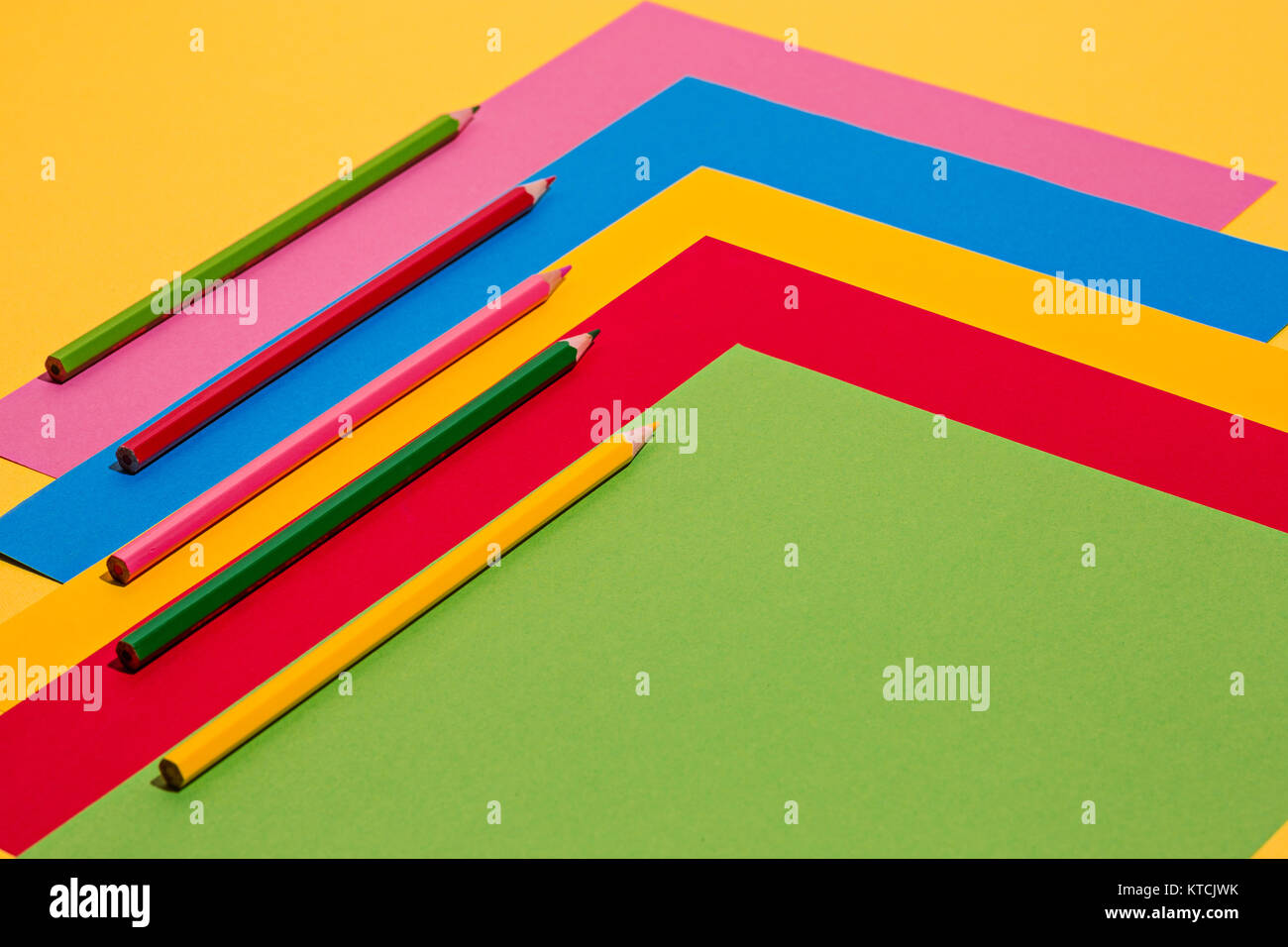 colored pencils and colour paper Stock Photo - Alamy