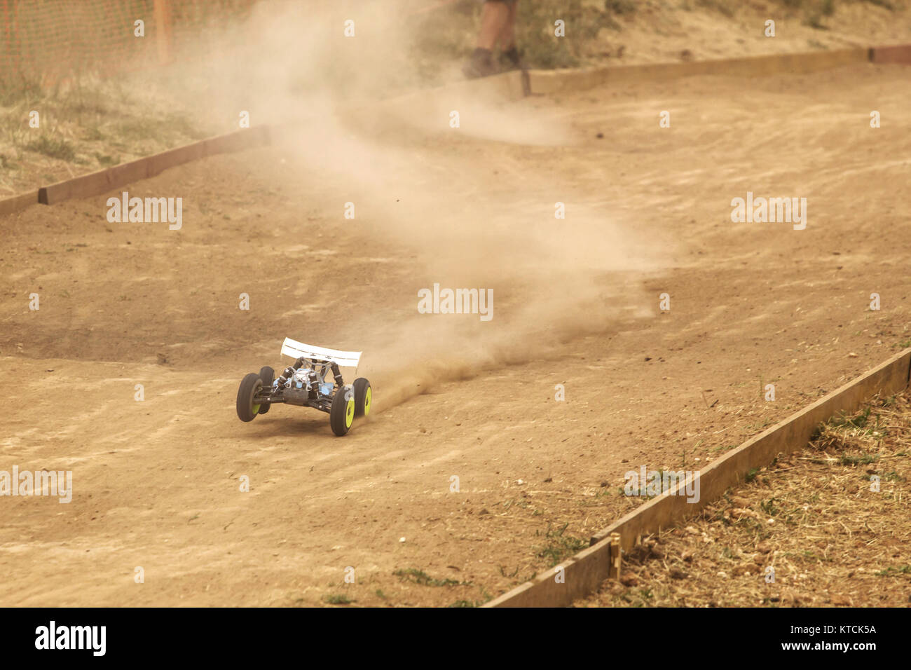 Radio controlled car model in race on dirt track Stock Photo - Alamy