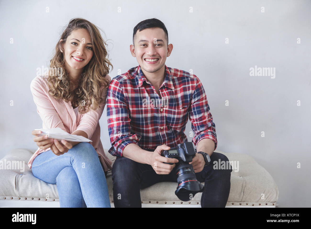 photographer sitting next to his model after photo session Stock Photo ...