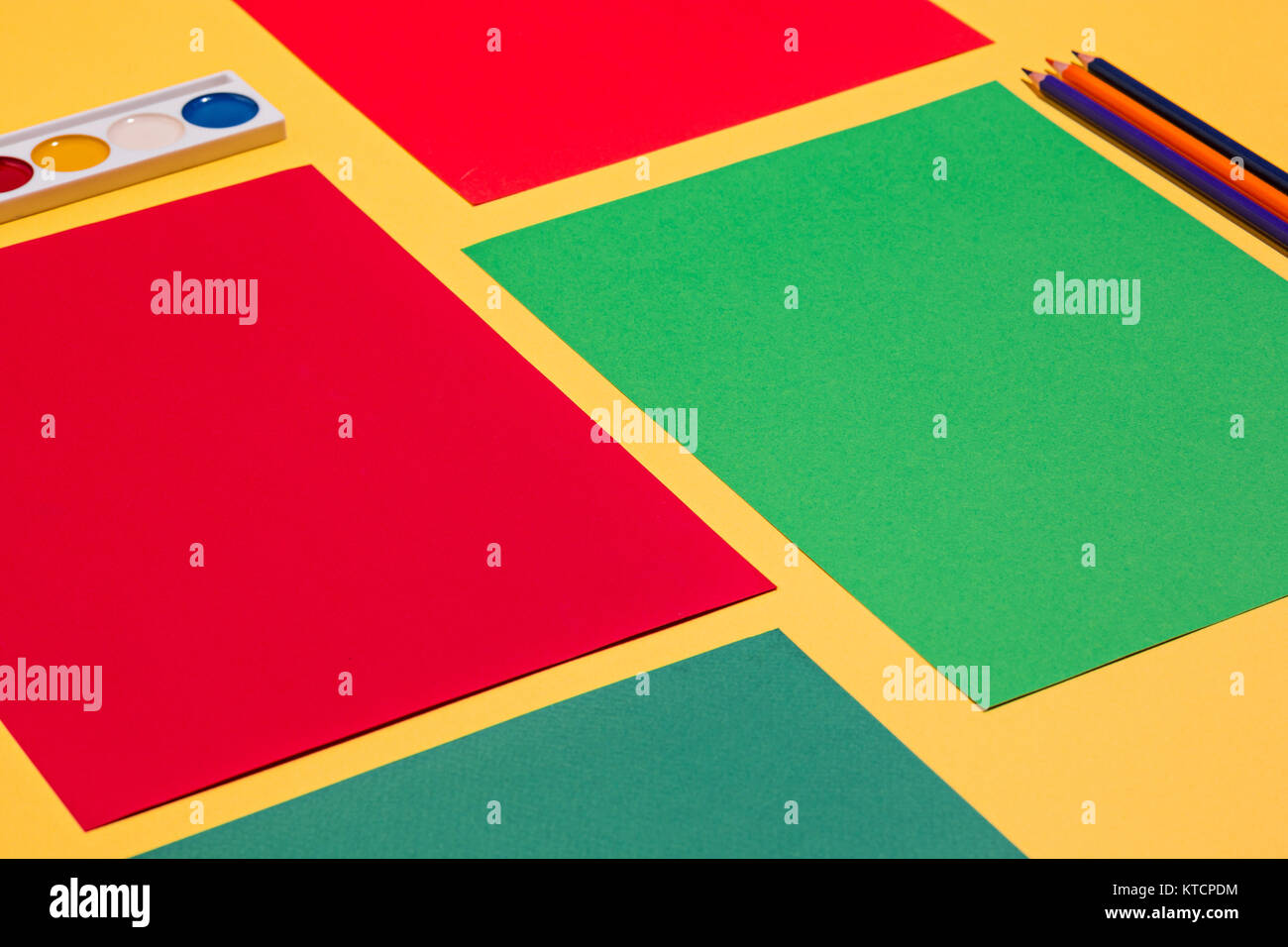 colored pencils and colour paper Stock Photo - Alamy