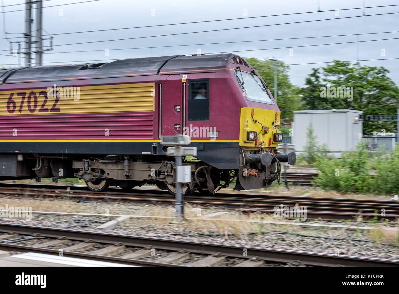 Fast moving train on tracks, captured with motion blur, showcasing ...