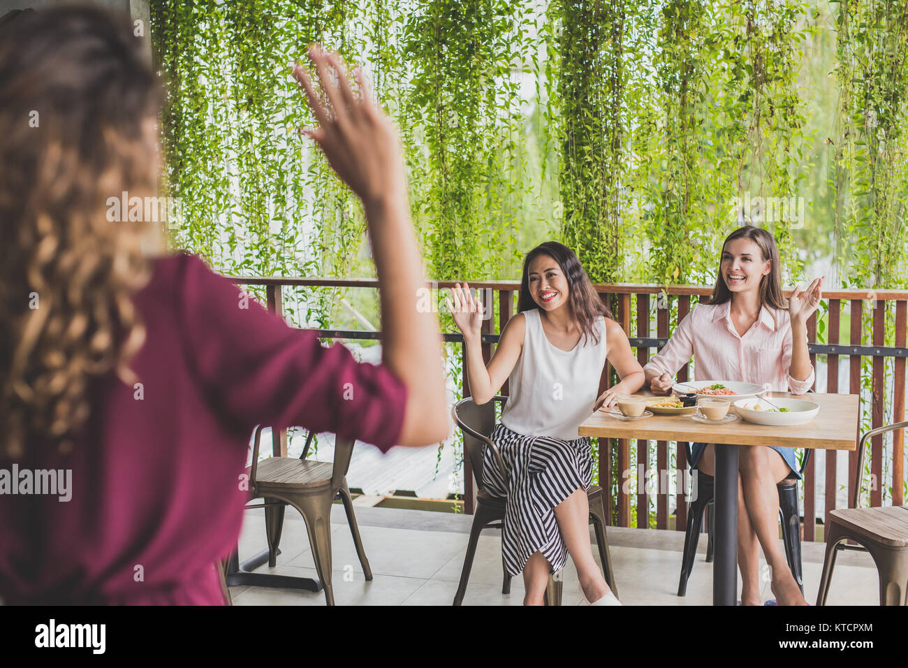 Waving hands to their friends hi-res stock photography and images - Alamy