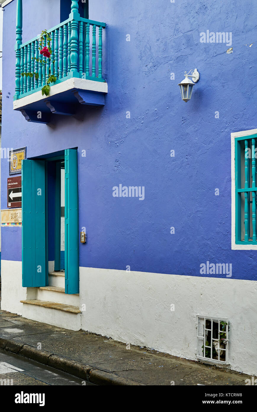 blue facade with window, typical colorful facades of houses in ...