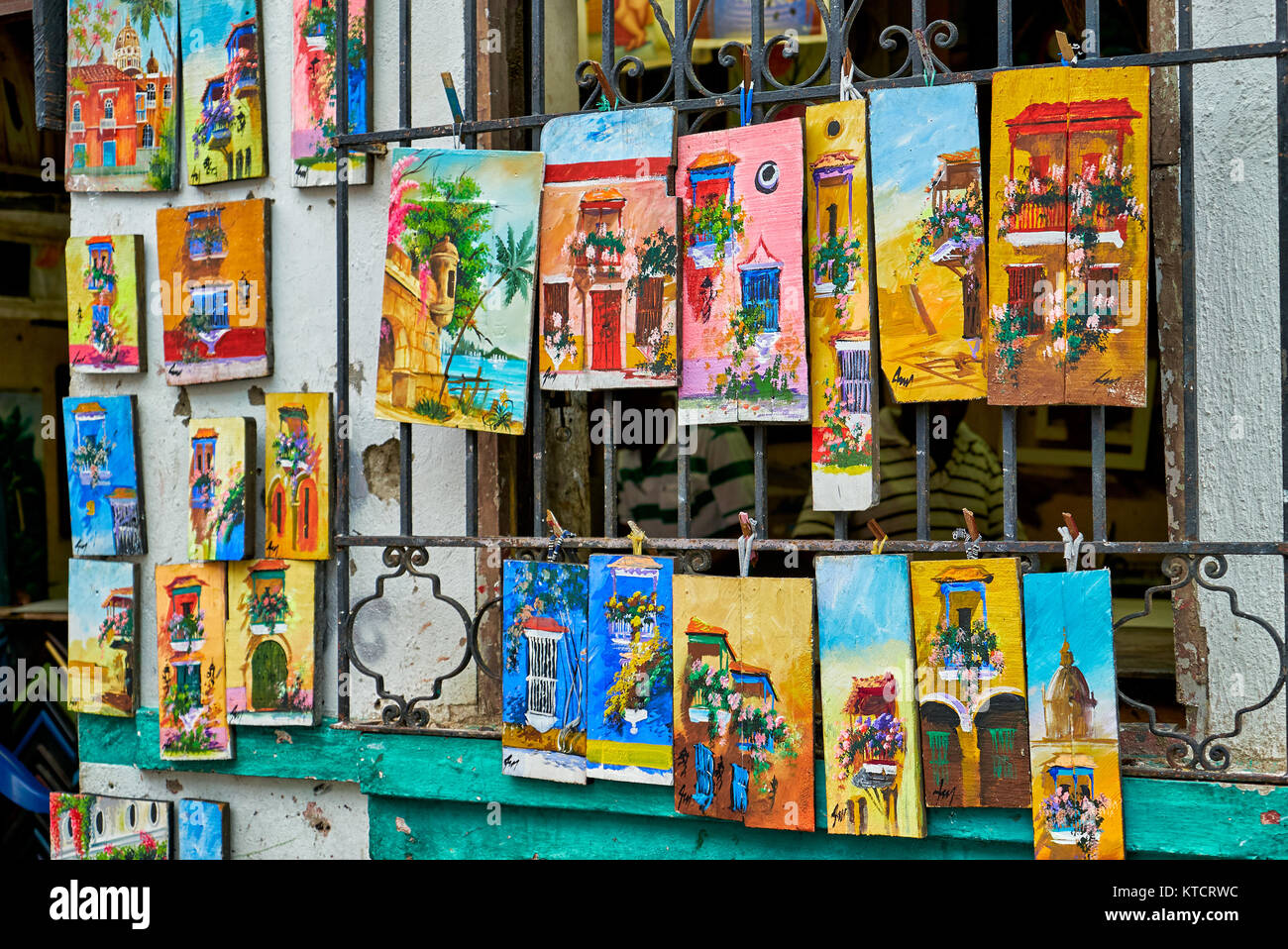 small shop with paintings on barred window at typical facades of ...