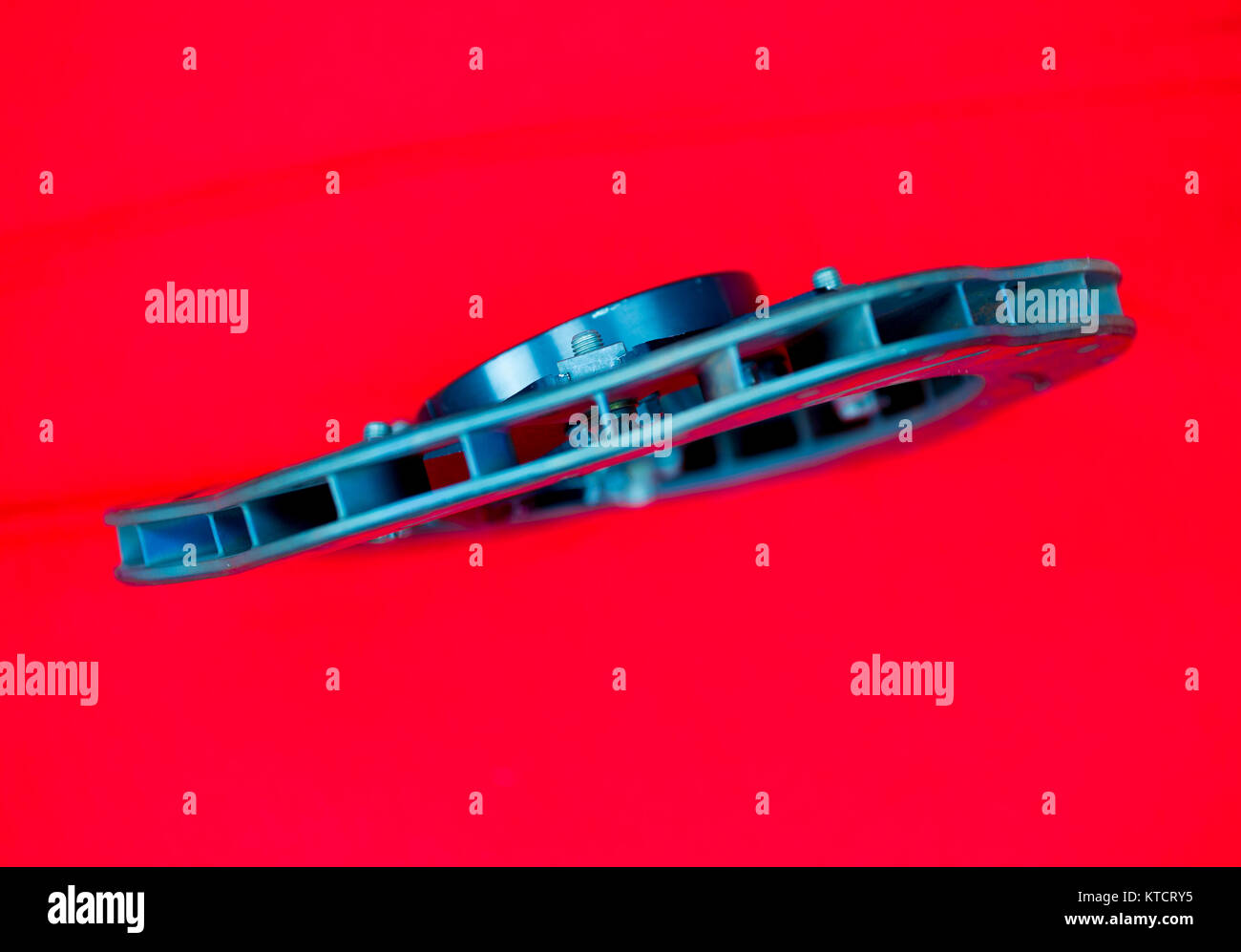 Broken, cracked and warped racing brake rotor on red background Stock ...