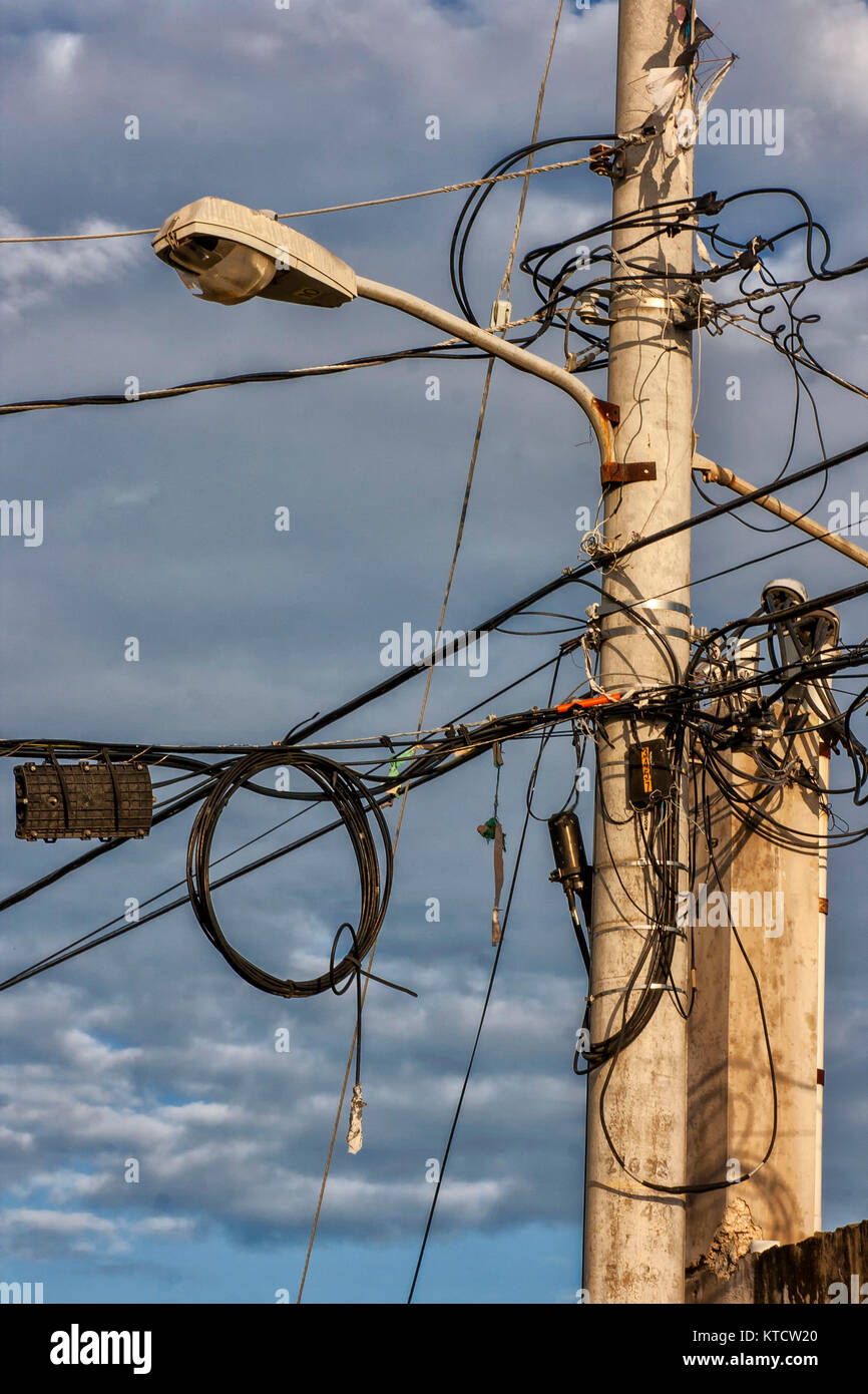 telegraph poles light and tangled cables, Jamaica Stock Photo - Alamy