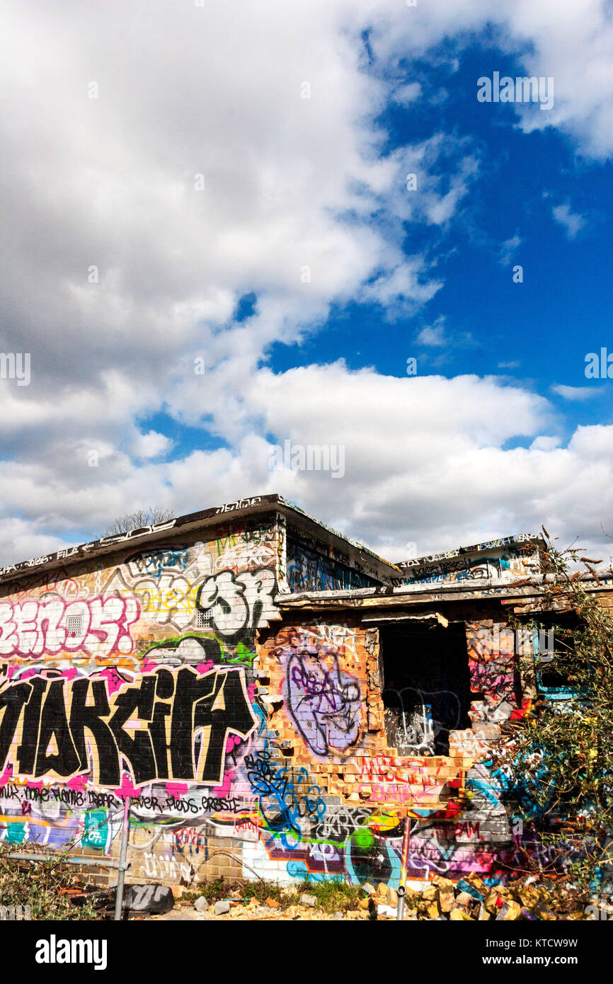 Graffiti covered building under a summer sky, London, England, United ...