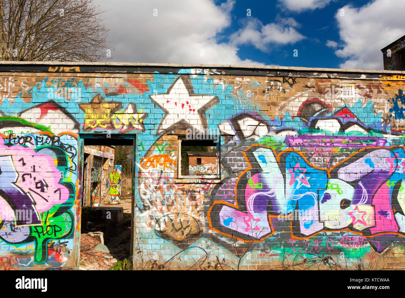 Graffiti star above similar door Stock Photo - Alamy
