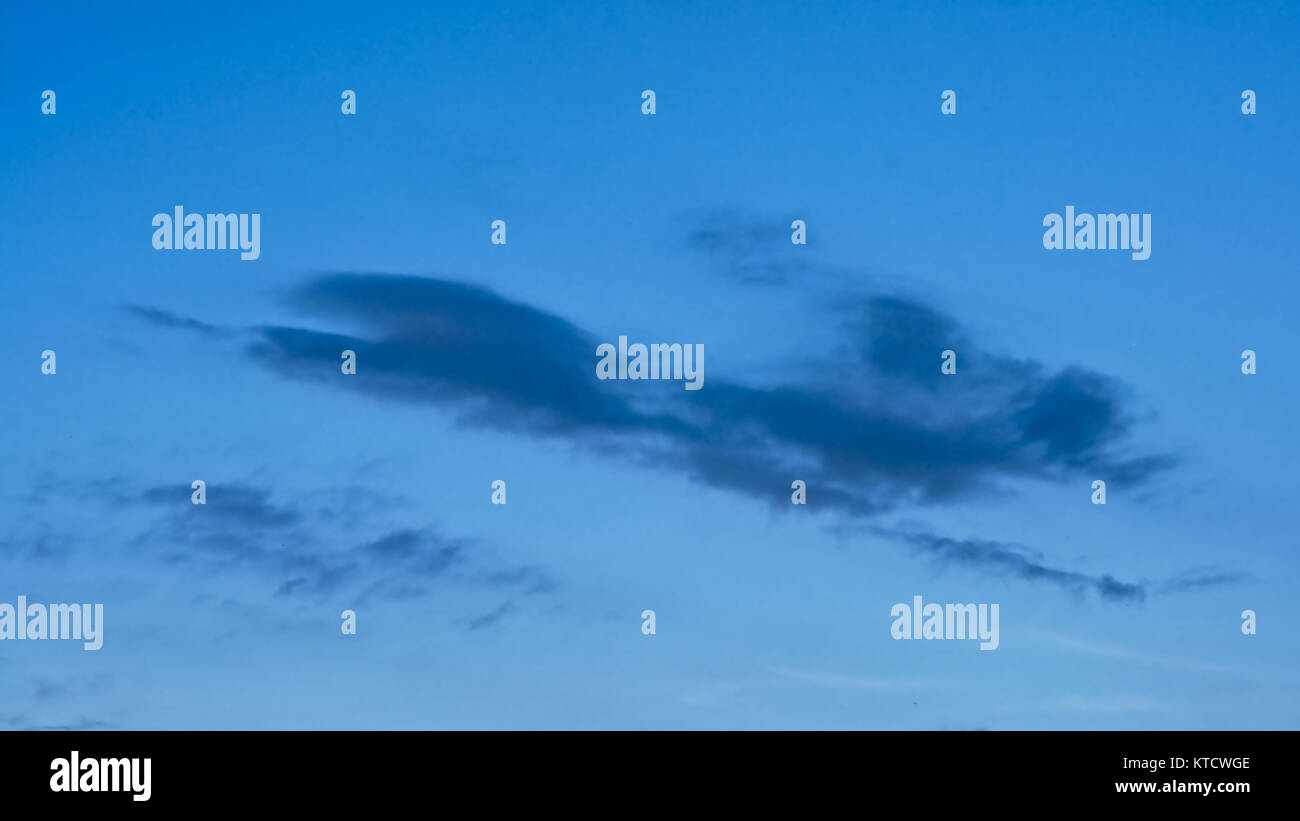 Weather background of dark grey cumulus clouds on a blue sky Stock ...