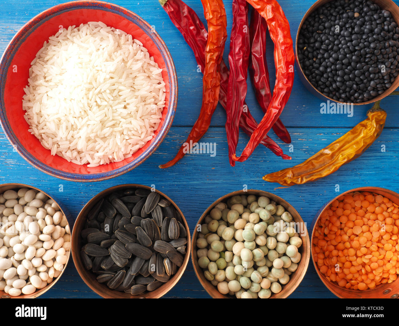 Colorful food ingredients on a blue wooden kitchen table Stock Photo ...