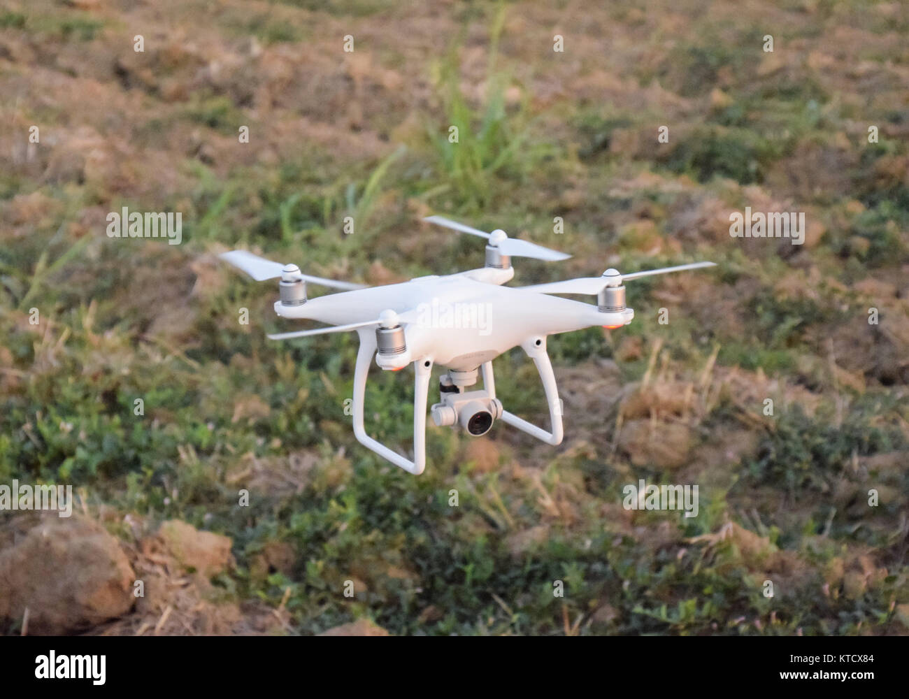 The drone, hovering above the ground Stock Photo - Alamy