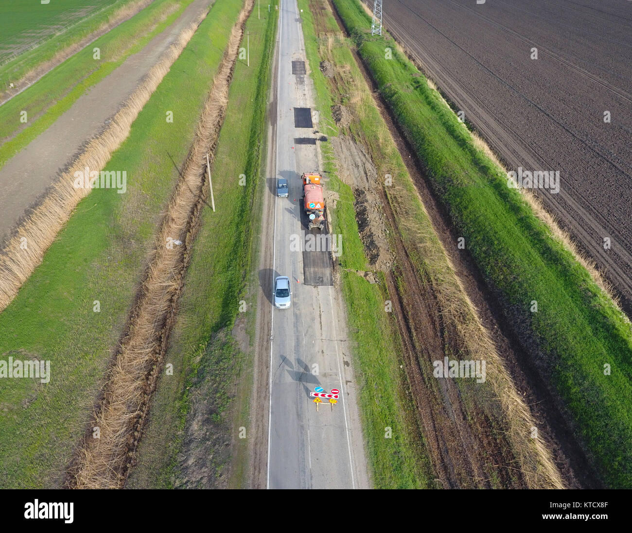 Top view of the road repair. Technics for repair of asphalt ...