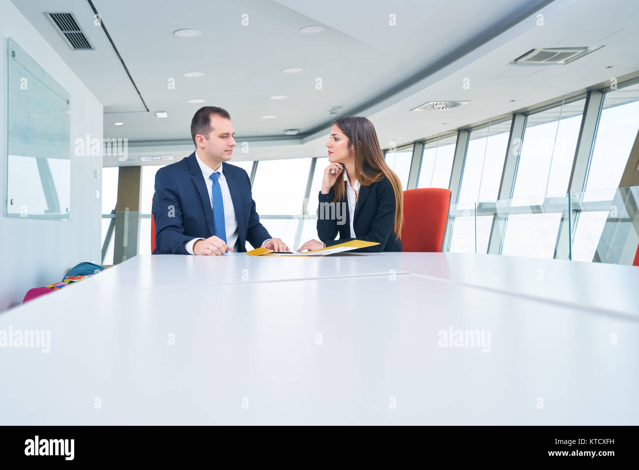 Businesspeople using laptop at conference table Stock Photo - Alamy Businesspeople using laptop at conference table Stock Photo - Alamy