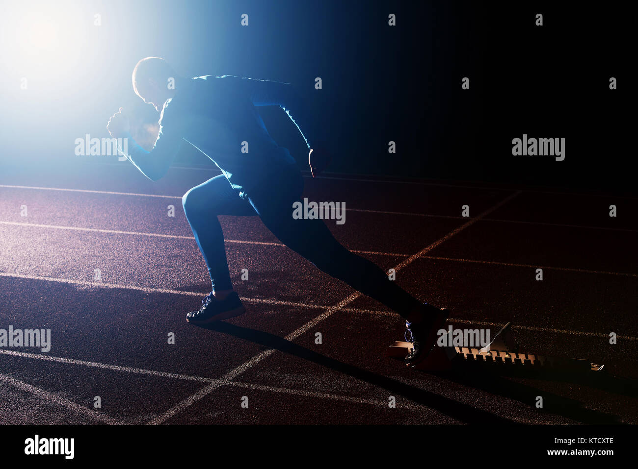Male Athlete Leaving Starting Blocks Stock Photos & Male Athlete ...