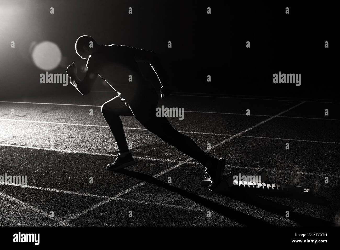Sport. Sprinter leaving starting blocks on the running track Stock ...