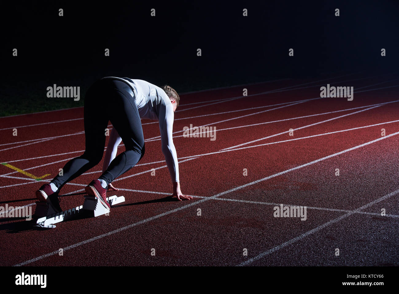 Sport. Sprinter leaving starting blocks on the running track Stock ...
