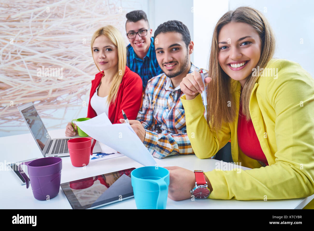 young startup people group in modern office have team meeting and ...