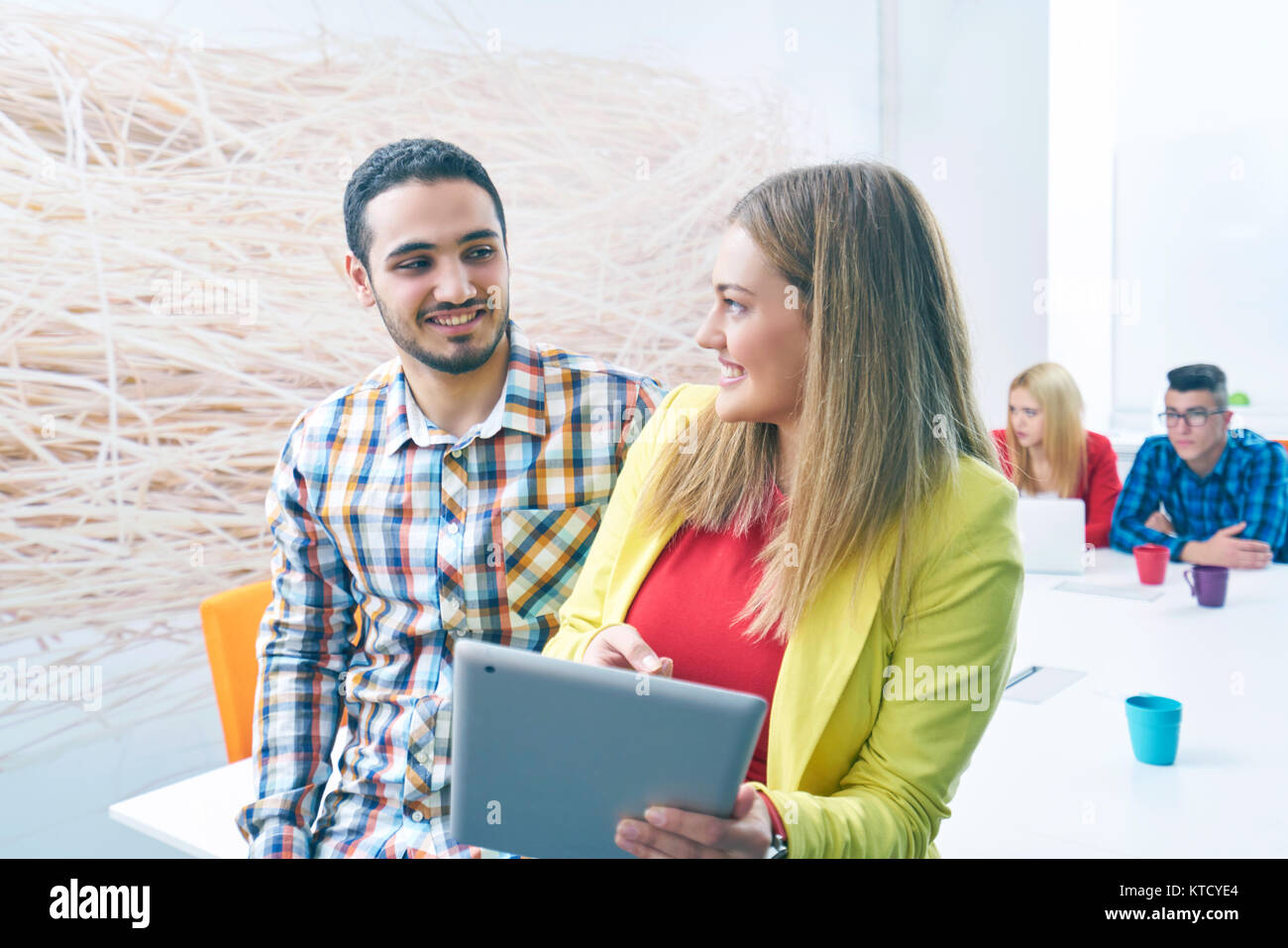 young startup people group in modern office have team meeting and ...