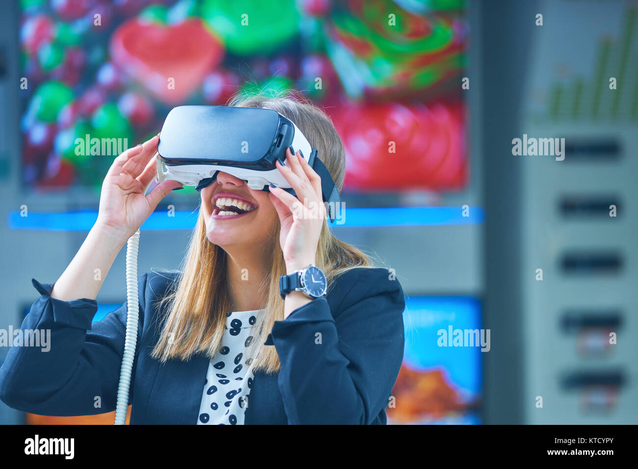 Young woman wearing virtual reality device Stock Photo - Alamy