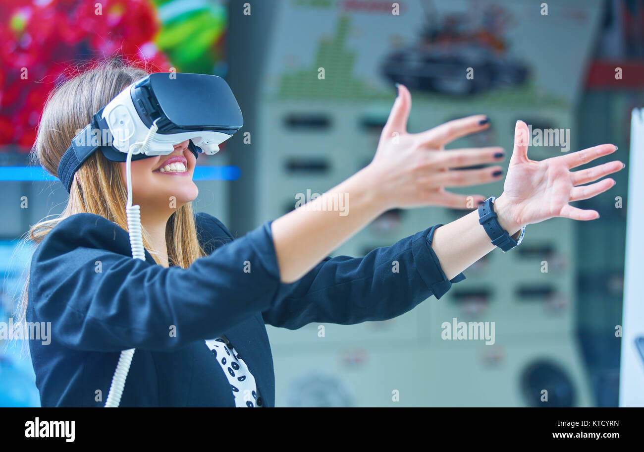 Young woman wearing virtual reality device Stock Photo - Alamy