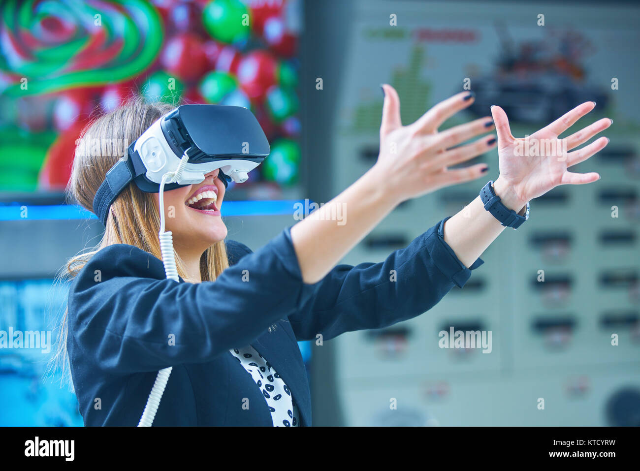 Young woman wearing virtual reality device Stock Photo - Alamy
