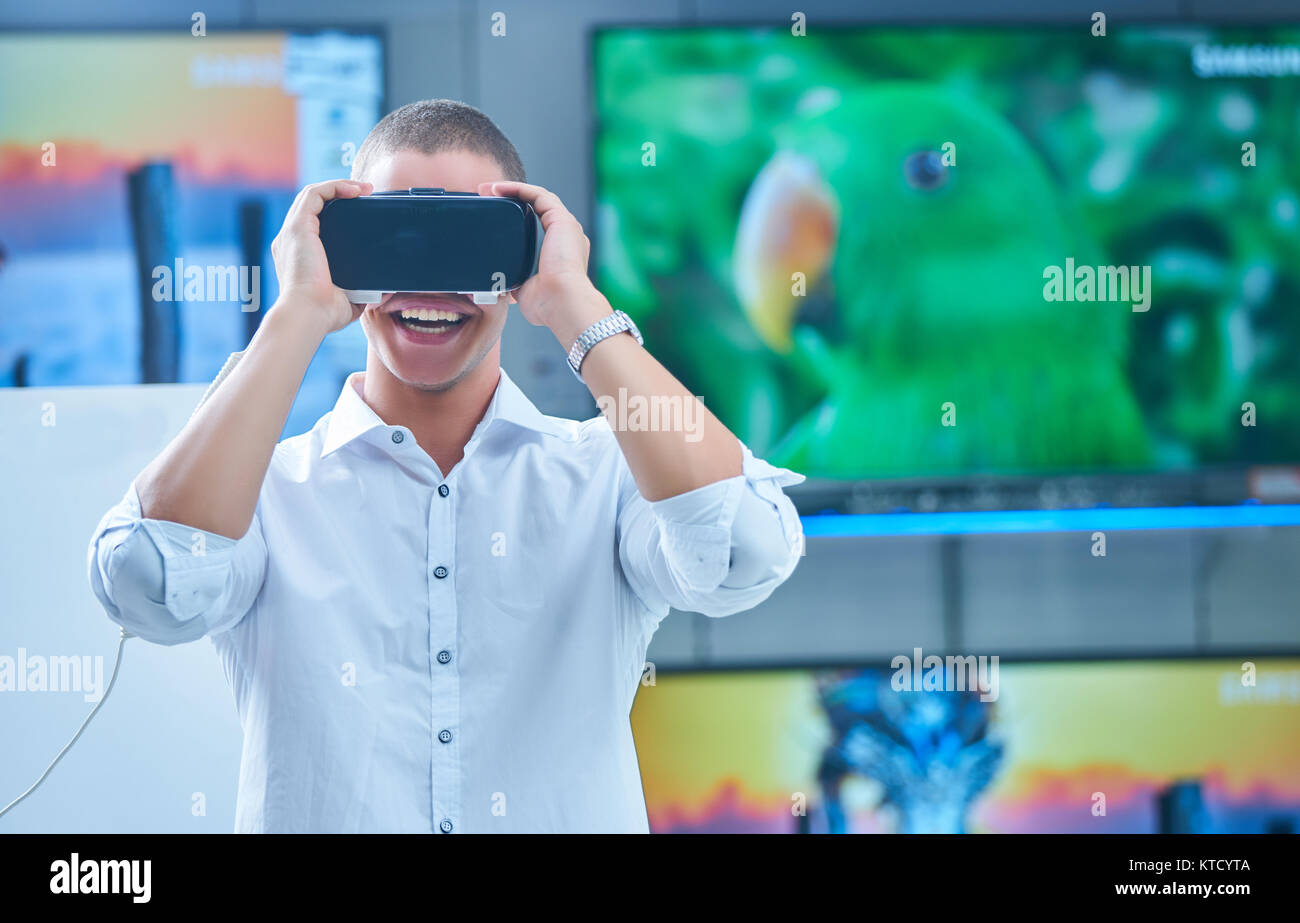 Man wearing virtual reality goggles Stock Photo - Alamy
