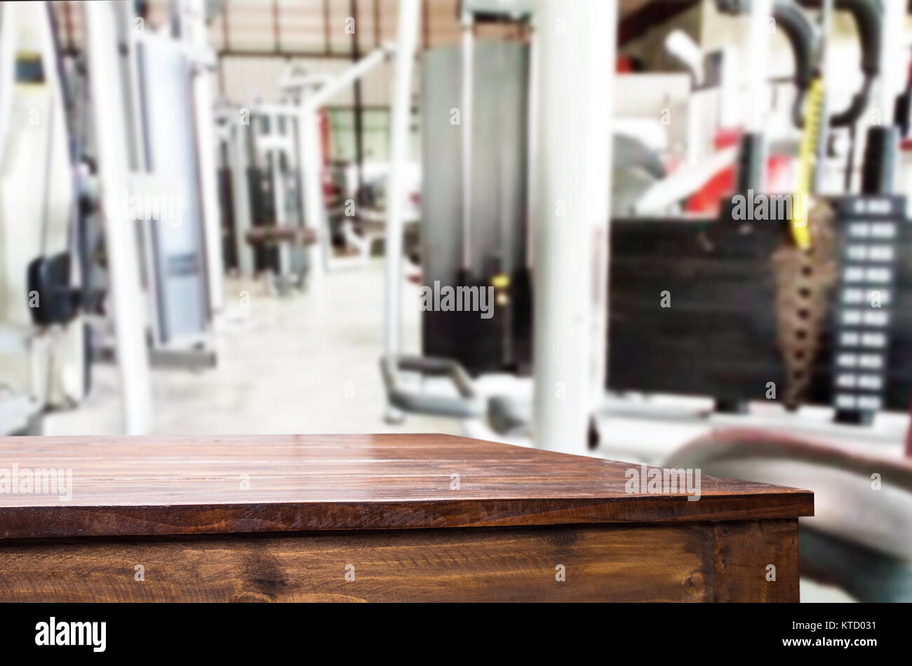 Wooden table on blurred background of fitness gym interior of modern ...