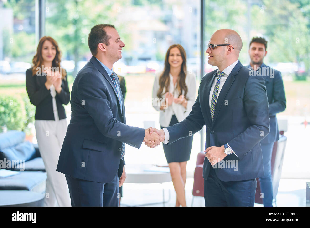 Business people shaking hands, finishing up a meeting in office Stock ...