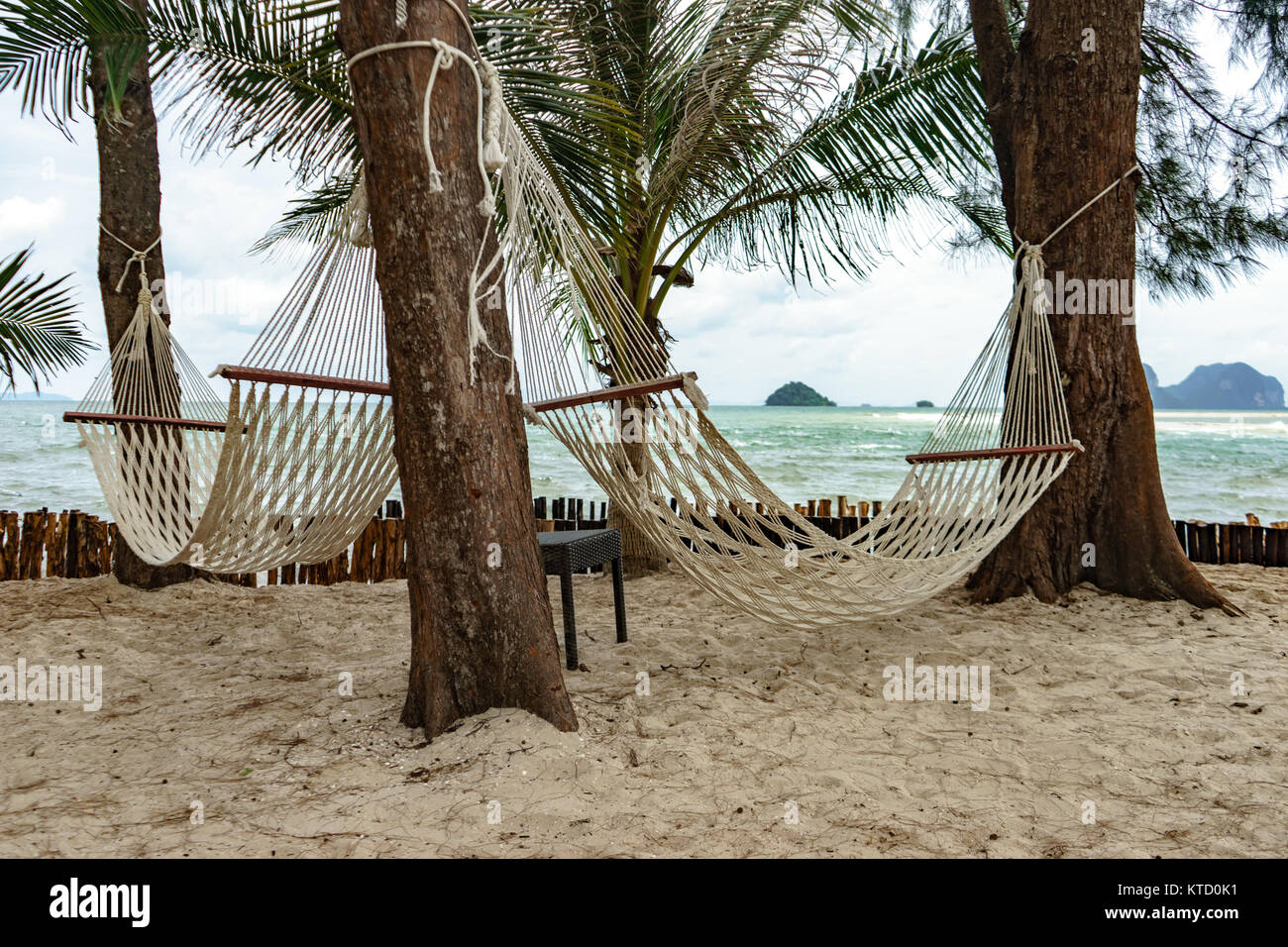 Relax Cot on Tree,sea Background Stock Photo - Alamy