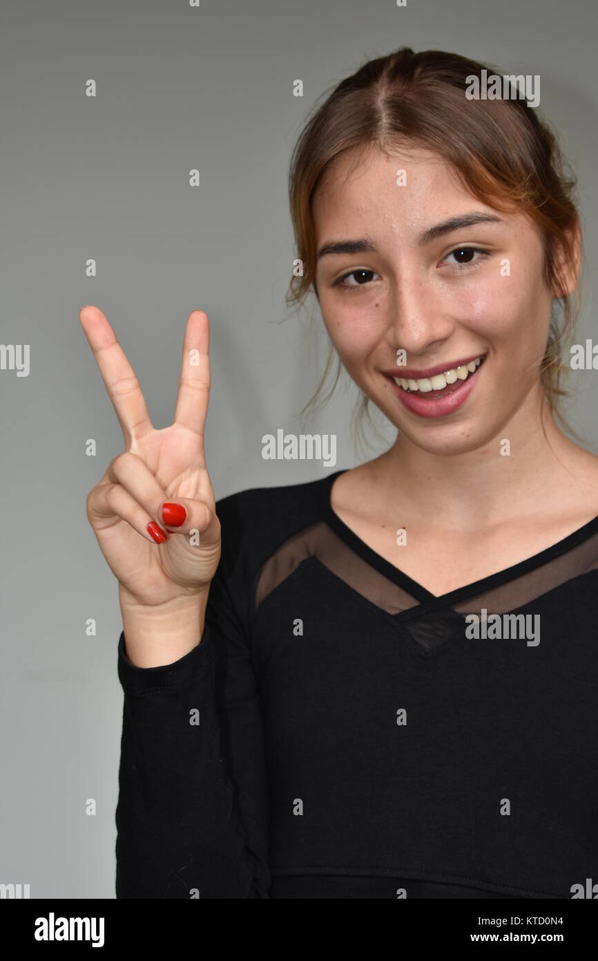 Hispanic Female And Peace Sign Stock Photo - Alamy