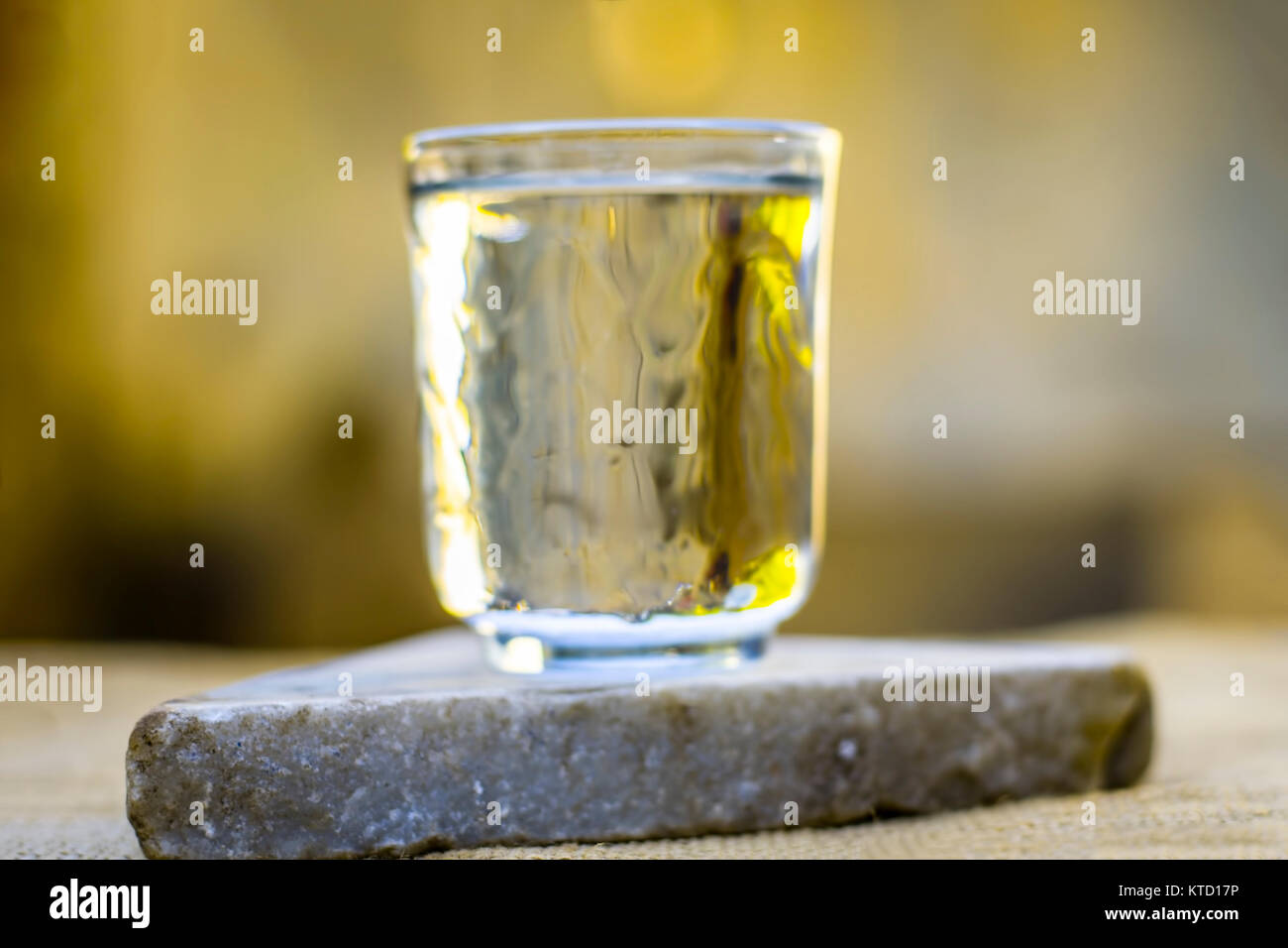 Pure water filled in a transparent glass with blur background Stock ...