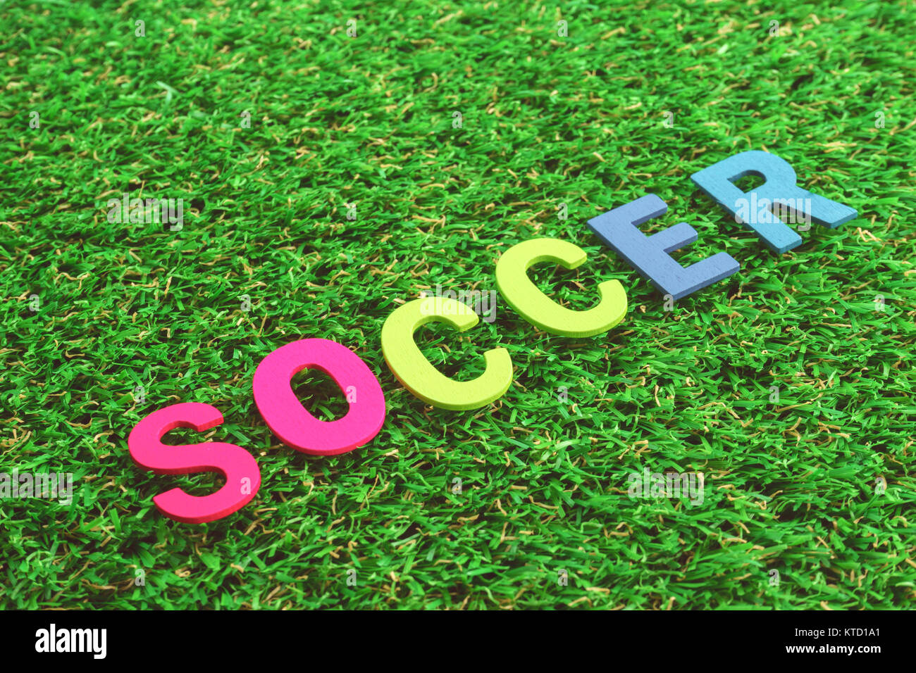 Colorful Wooden Alphabet Word Soccer on green grass background Stock ...