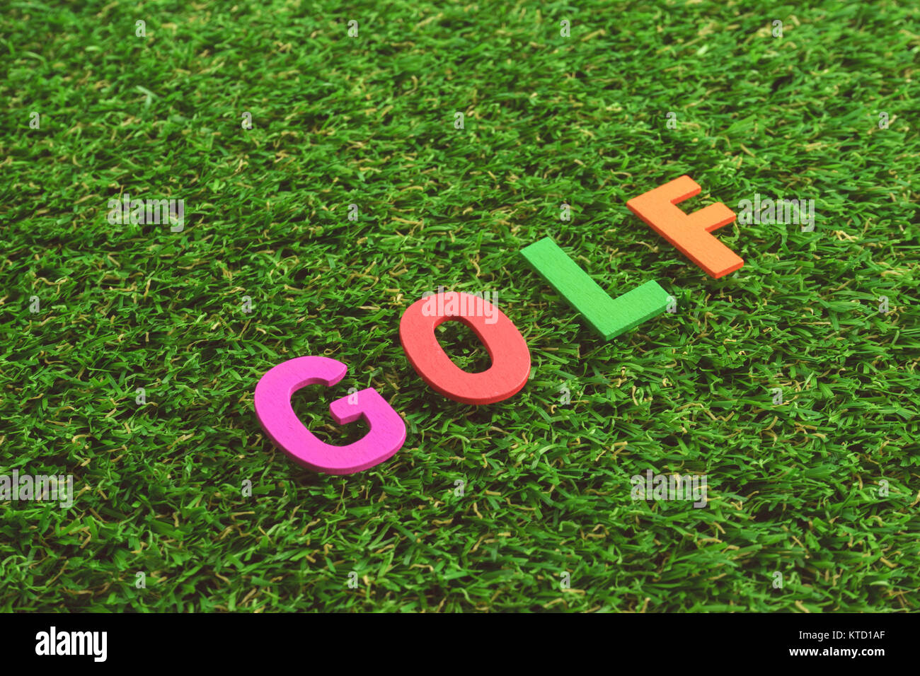 Colorful Wooden Alphabet Word Golf on green grass background Stock ...