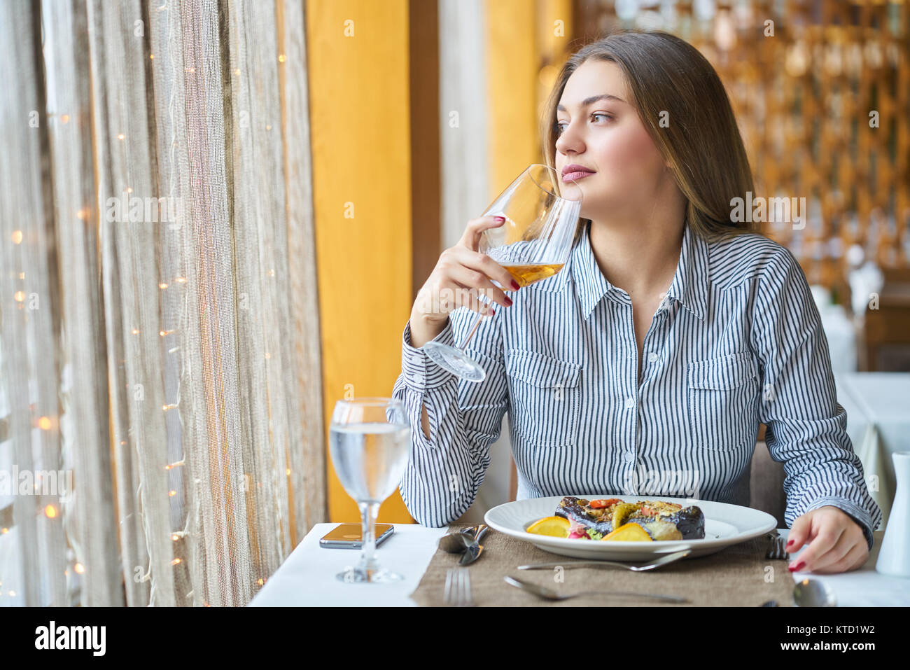 Lifestyle. Beautiful woman in modern restaurant Stock Photo - Alamy