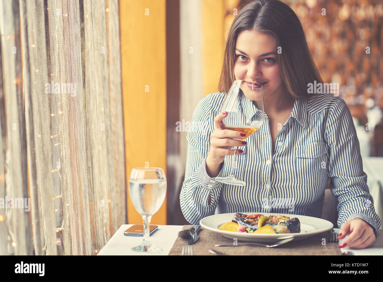 Lifestyle. Beautiful woman in modern restaurant Stock Photo - Alamy
