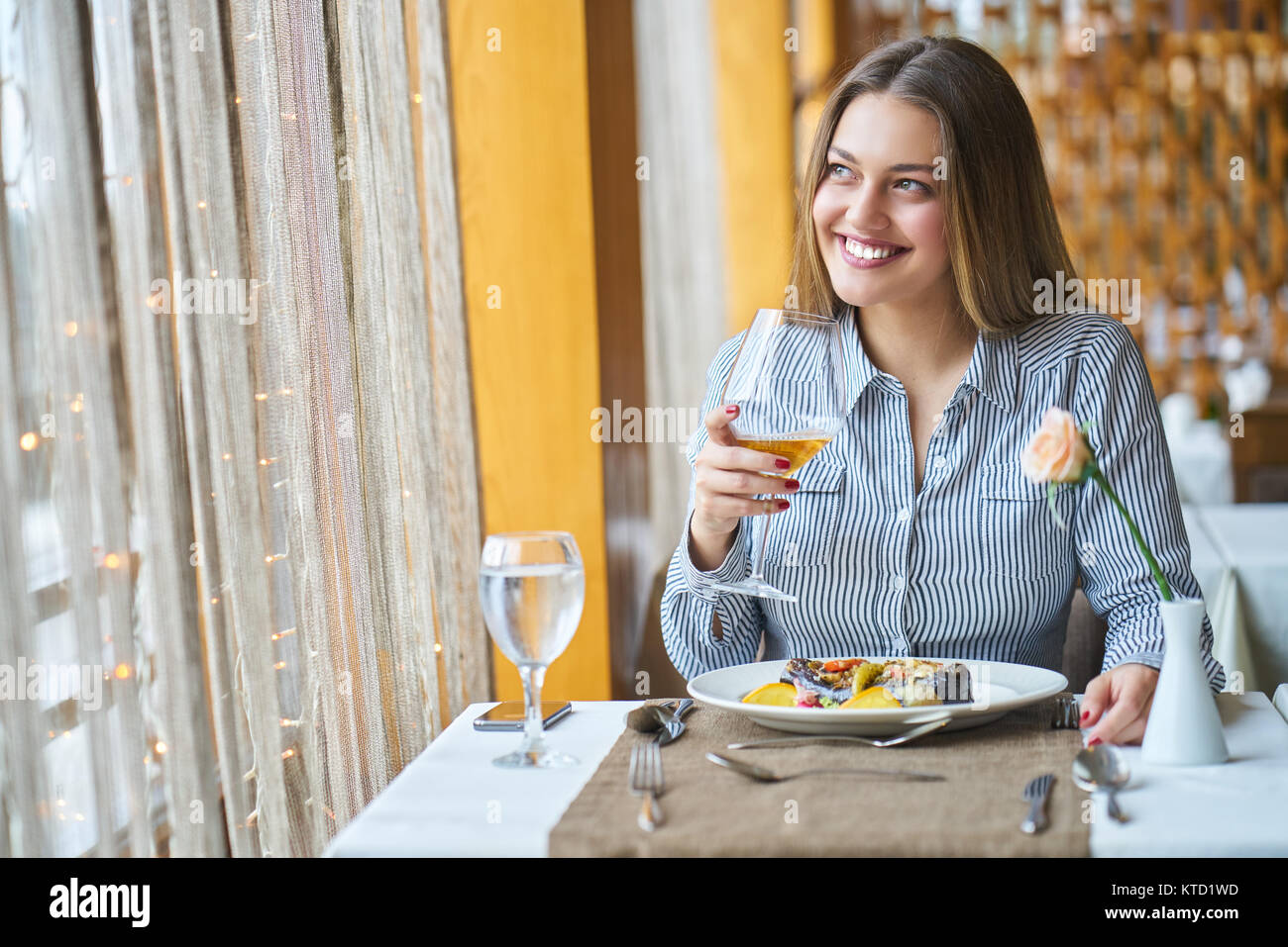 Lifestyle. Beautiful woman in modern restaurant Stock Photo - Alamy